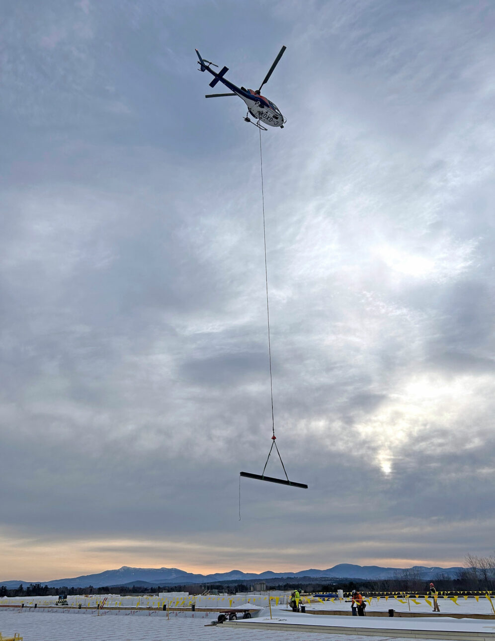 Helicopter Pick Secures Skylight Ridge Beams - PC Construction